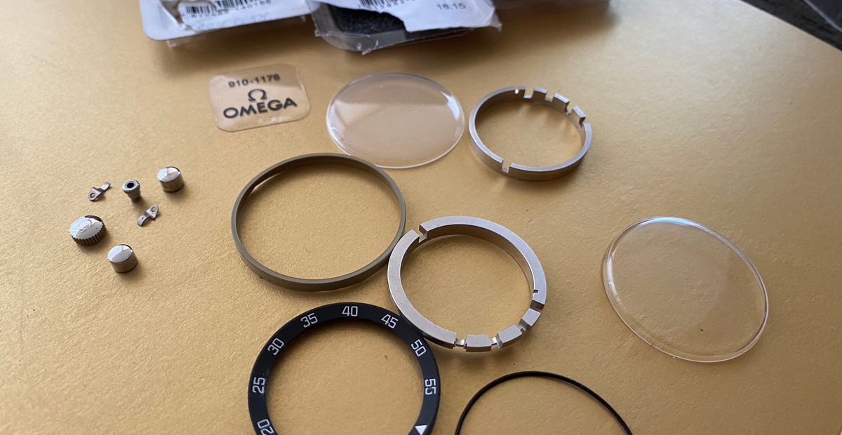 SOLD - Omega parts for 861 movements spacer, clamps, crown, pusher ...