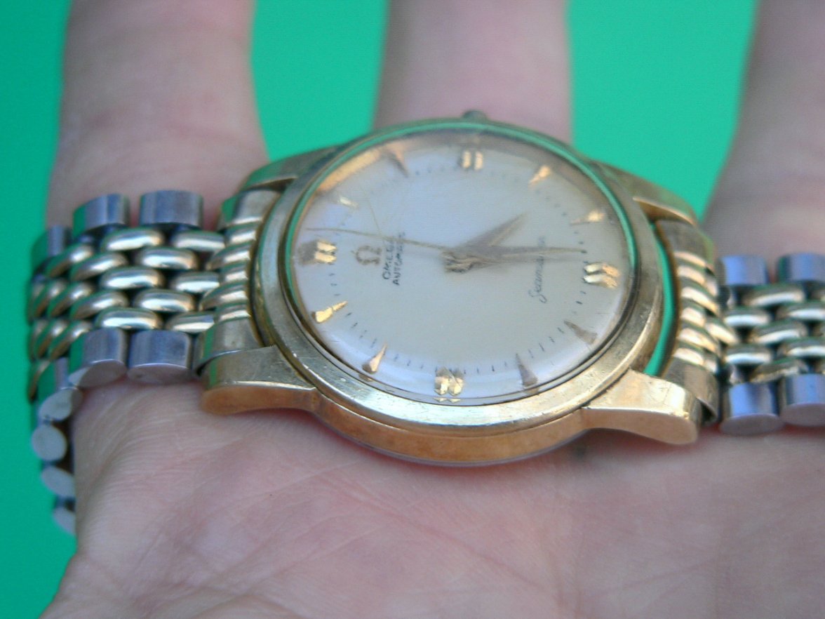 Popping off the crystal on a front open Omega Automatic Seamaster ...